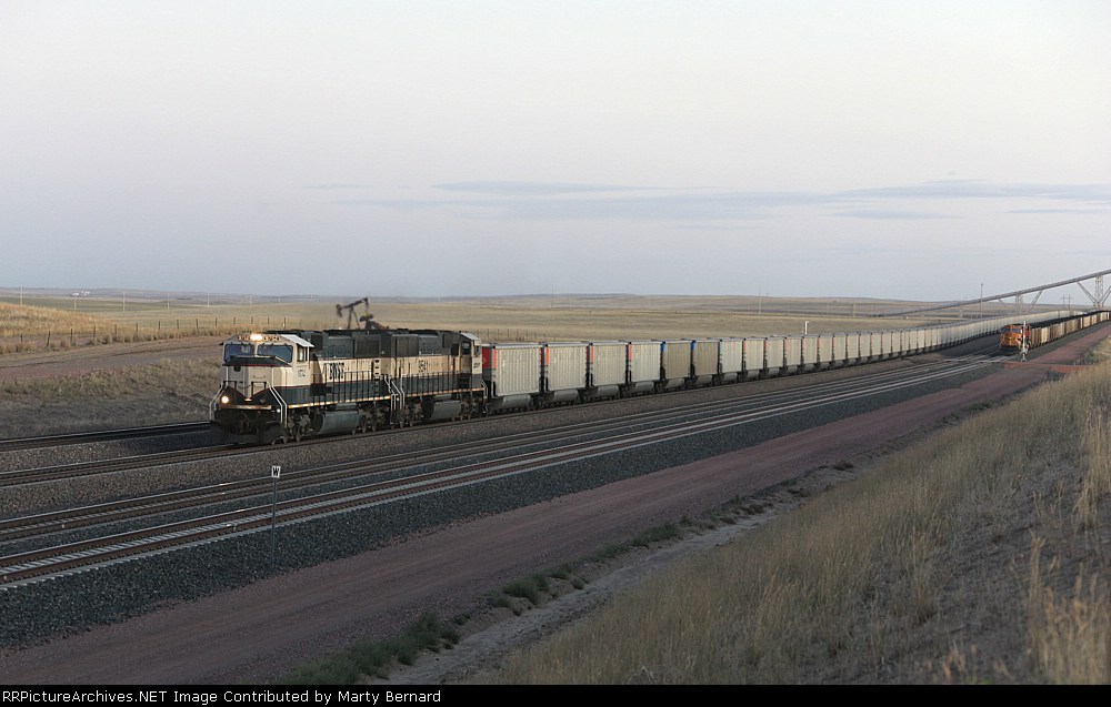 Empty BNSF 9752 (with a burned out ditch light) and 9541 NB (RR west) at Sunset With a SB in the ...